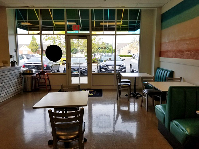 Morning light streams through the front windows, illuminating the clean, simple dining area. A peaceful spot to contemplate life's important questions&mdash;like which donut next?