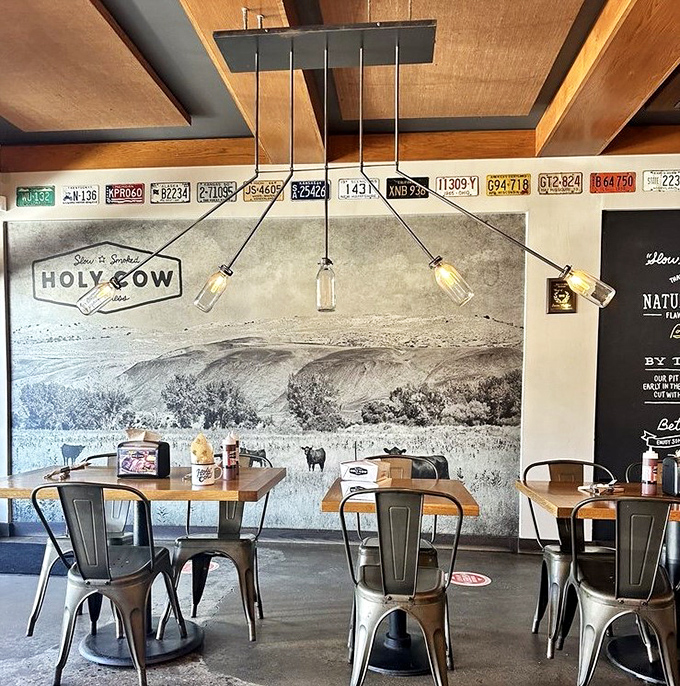 The mural depicts pastoral scenes, as if the cows are saying "we lived well" before becoming dinner.