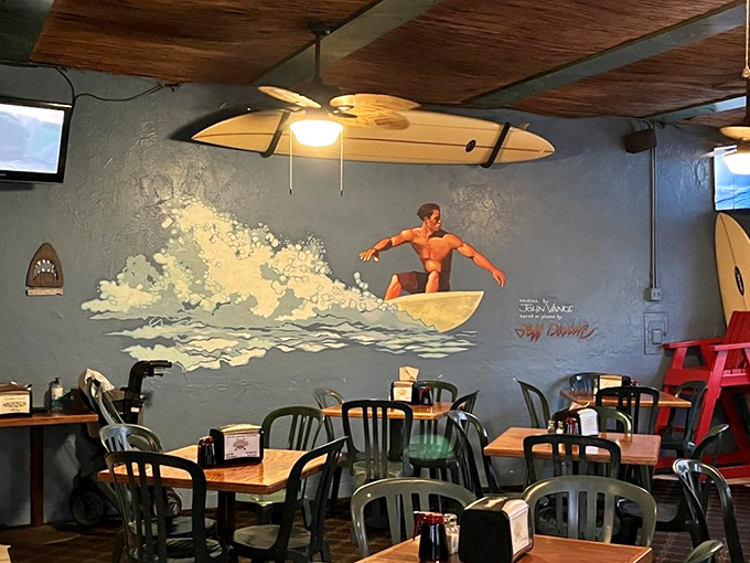 Surf art and ocean-blue walls transport you to breakfast beach heaven. The surfboard ceiling fans are both practical and thematically on-point.