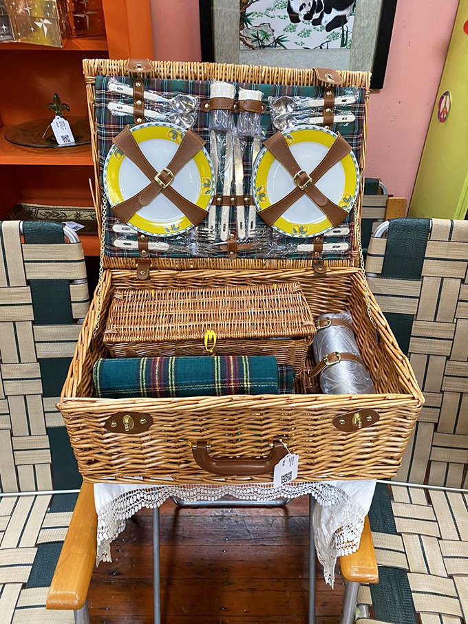 The picnic basket of Downton Abbey dreams. Those yellow plates have seen more elegant outdoor dining than your average paper plate ever will.