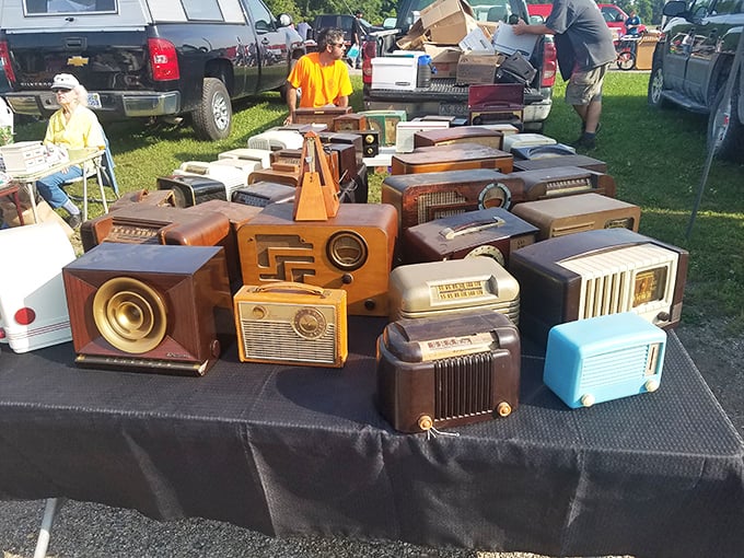 Radio stars of yesteryear stand at attention, each wooden cabinet holding the ghosts of baseball games and soap operas past.