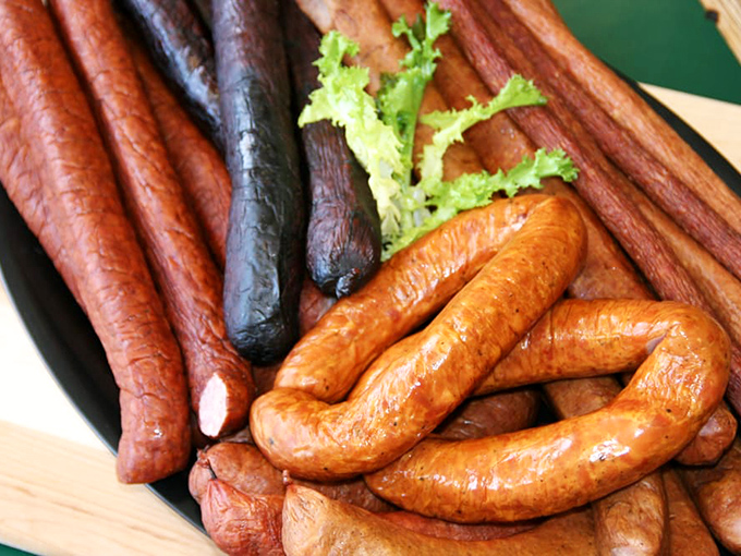 A charcuterie board's worth of kielbasa varieties&mdash;each one a different shade of smoky perfection, from deep mahogany to sunset amber.