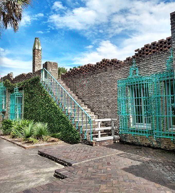 Atalaya's turquoise-trimmed stairway beckons. Part Spanish fortress, part artist's haven, all architectural wonder against Carolina blue skies.