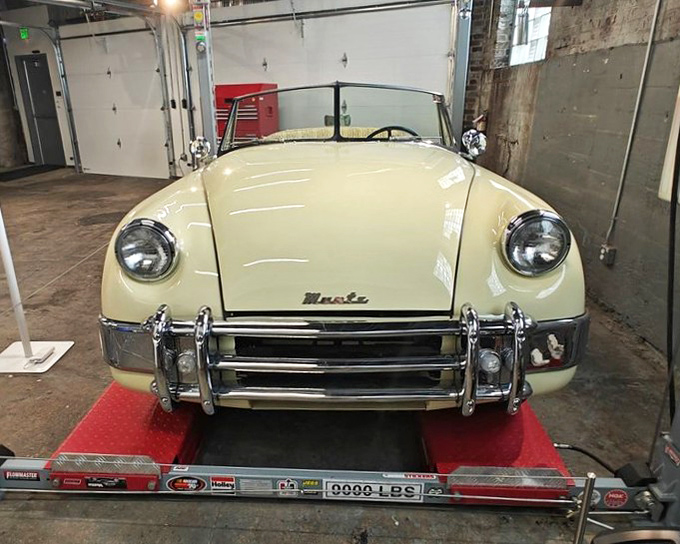 This butter-yellow Austin-Healey sits patiently on its measurement platform, a British gentleman athlete waiting for its next chance to dance through Tennessee backroads.