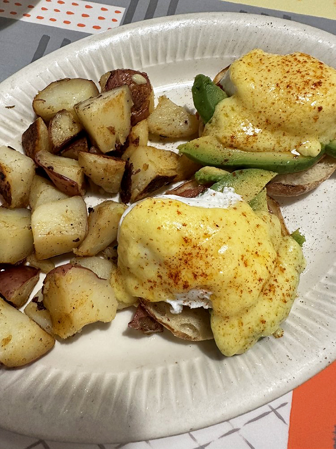 Benedict with avocado&mdash;where traditional breakfast formality meets California casual. The hollandaise sauce creates tiny lakes of happiness.