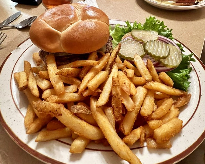 This isn't just a burger&mdash;it's architecture. A towering testament to the art of lunch, with fries that could convert a salad-eater.