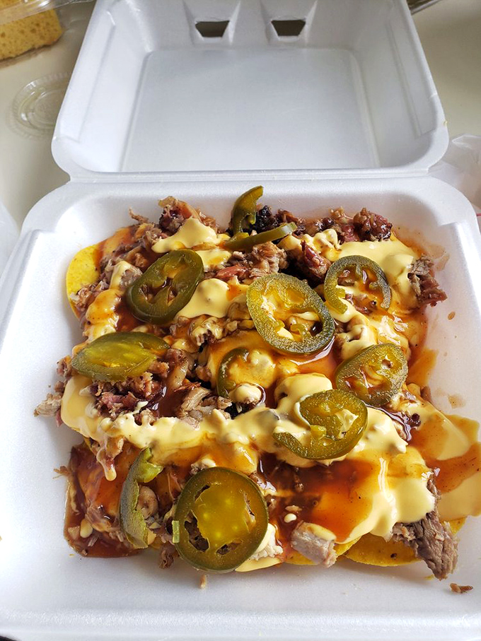 BBQ nachos topped with jalape&ntilde;os for those who like their indulgence with a kick. A beautiful mess that's worth every napkin.