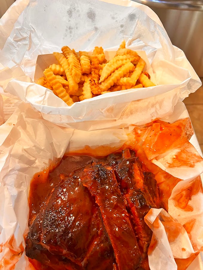 BBQ and fries: a love story older than time. That sauce-soaked meat alongside crispy potatoes is the ultimate power couple.
