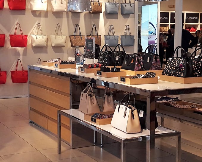 Handbag heaven&mdash;where purses of every hue stand at attention, silently judging your current worn-out tote while whispering, "Take me home."