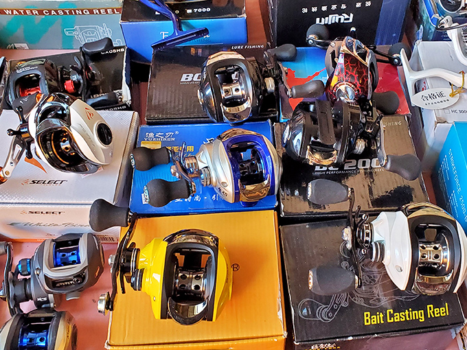 Fishing reel wonderland where anglers debate technical specifications while their spouses mysteriously disappear to the jewelry section.