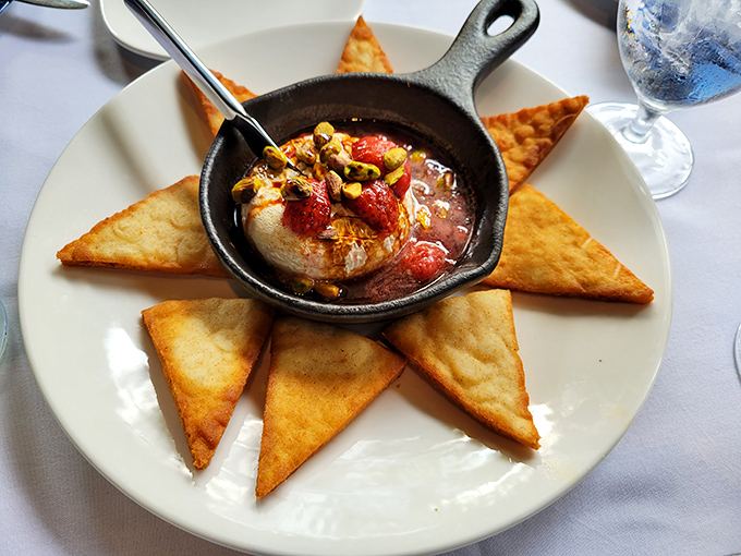 Baked brie that oozes sophistication and melted cheese in equal measure, served with golden triangular perfection.