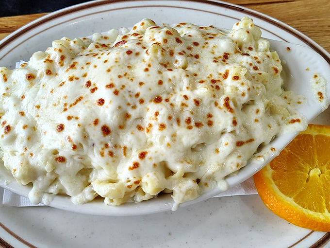 Baked macaroni and cheese with a golden crown that would make any comfort food monarch weep tears of pure joy.