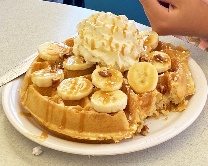This isn't just a waffle&mdash;it's a dessert masquerading as breakfast, where bananas and whipped cream create an alibi for morning indulgence.