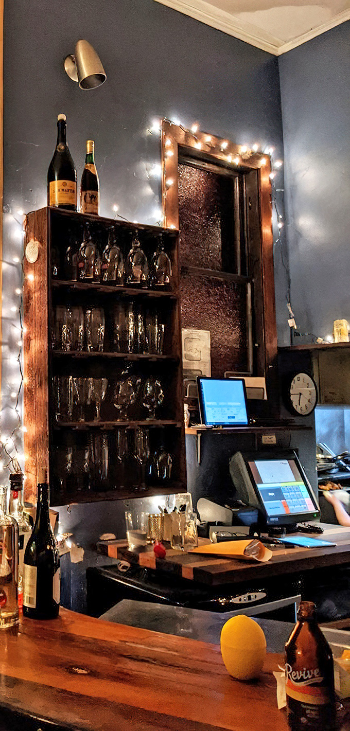 The bar area glows with string lights, creating that "I've discovered something special" feeling that makes neighborhood spots legendary.