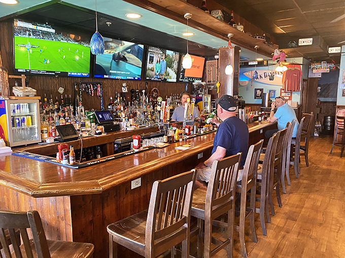 The bar stretches invitingly, promising cold drinks and front-row seats to whatever game is playing&mdash;a sanctuary for sports and seafood lovers.