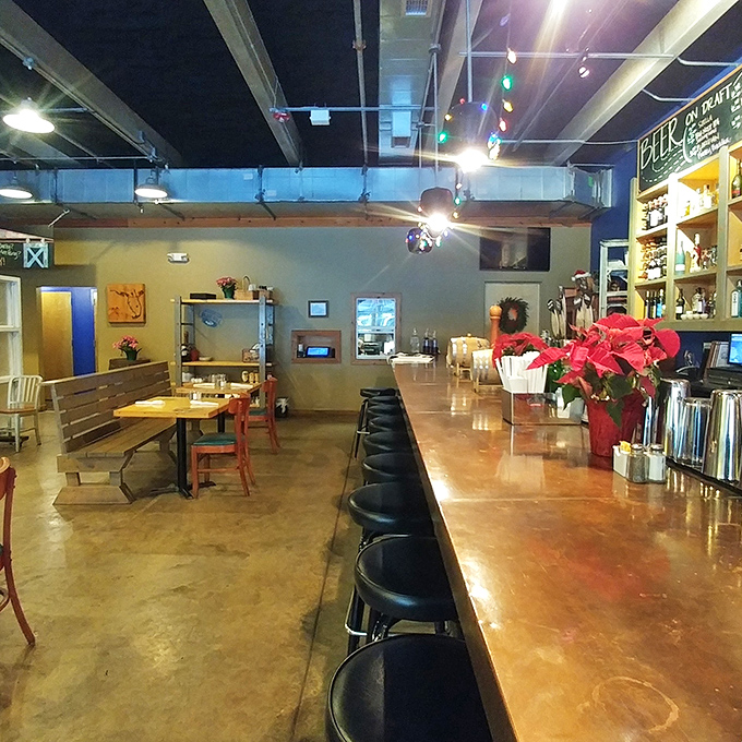 The bar area beckons with its warm wood tones and holiday cheer, promising conversations that flow as smoothly as the drinks.