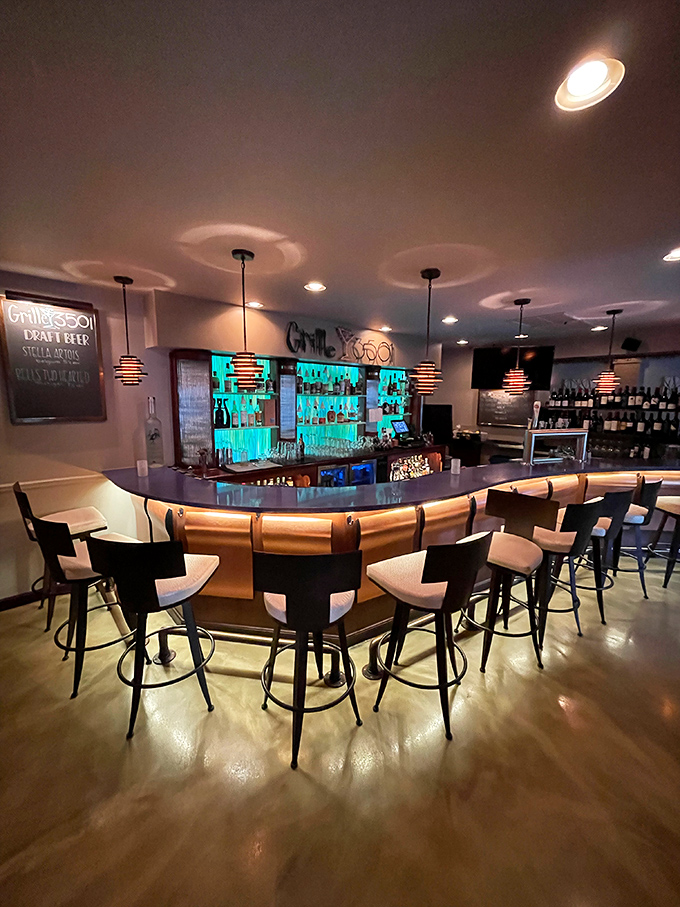 The bar beckons like a sophisticated friend who always knows exactly what you need.