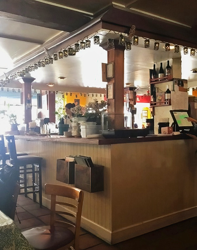 The bar area&mdash;where strangers become friends over shared pizza recommendations and wine-fueled debates about toppings.