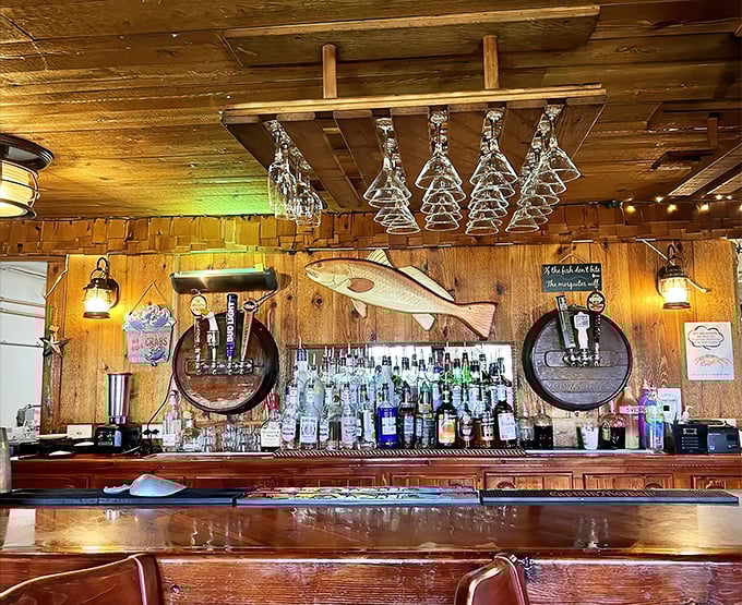 A bar that understands the importance of good lighting, cold drinks, and wooden everything. Those fish carvings have witnessed countless "you should have seen the one that got away" stories.