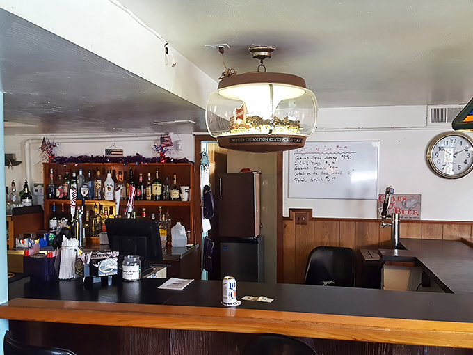 The bar area&mdash;where local stories flow as freely as the drinks, under the watchful gaze of a ship-in-a-bottle light fixture.