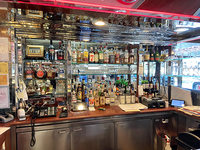 The bar area doesn't just serve drinks&mdash;it serves possibilities, with bottles standing at attention like soldiers in a delicious army.