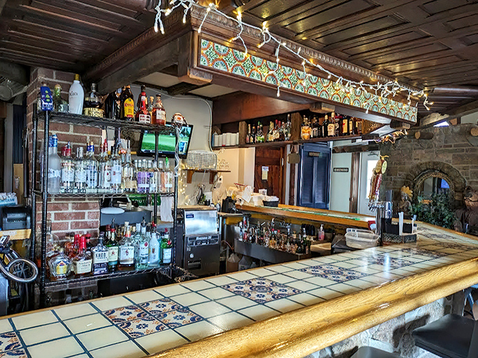 The bar's decorative tiles and warm wood tones create an atmosphere that says "your favorite neighborhood spot" even if you're visiting from miles away.