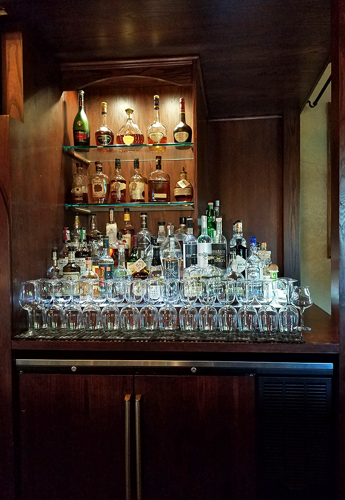 This isn't just a bar display&mdash;it's an adult candy store where the bottles gleam like jewels and promise sophisticated pleasures for discerning palates.