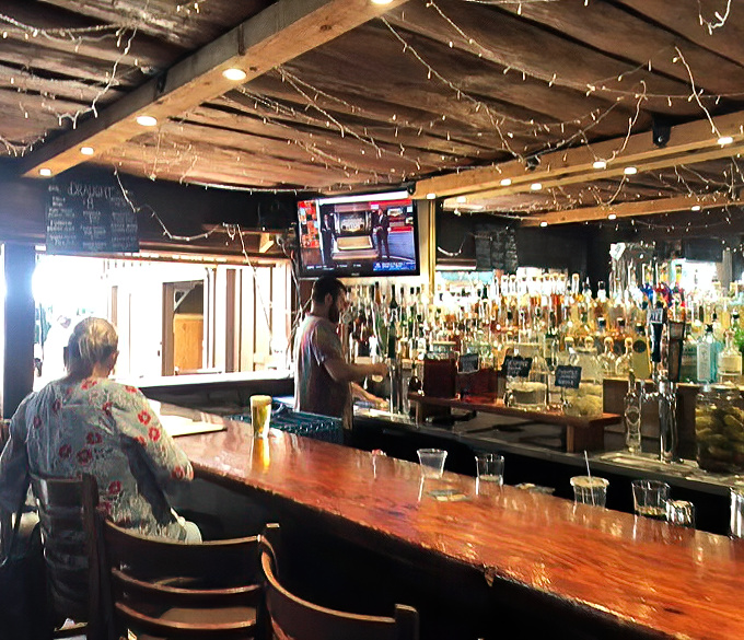 The bar area strikes that perfect balance between "I'm on vacation" and "I feel like a local." String lights make everything more magical.