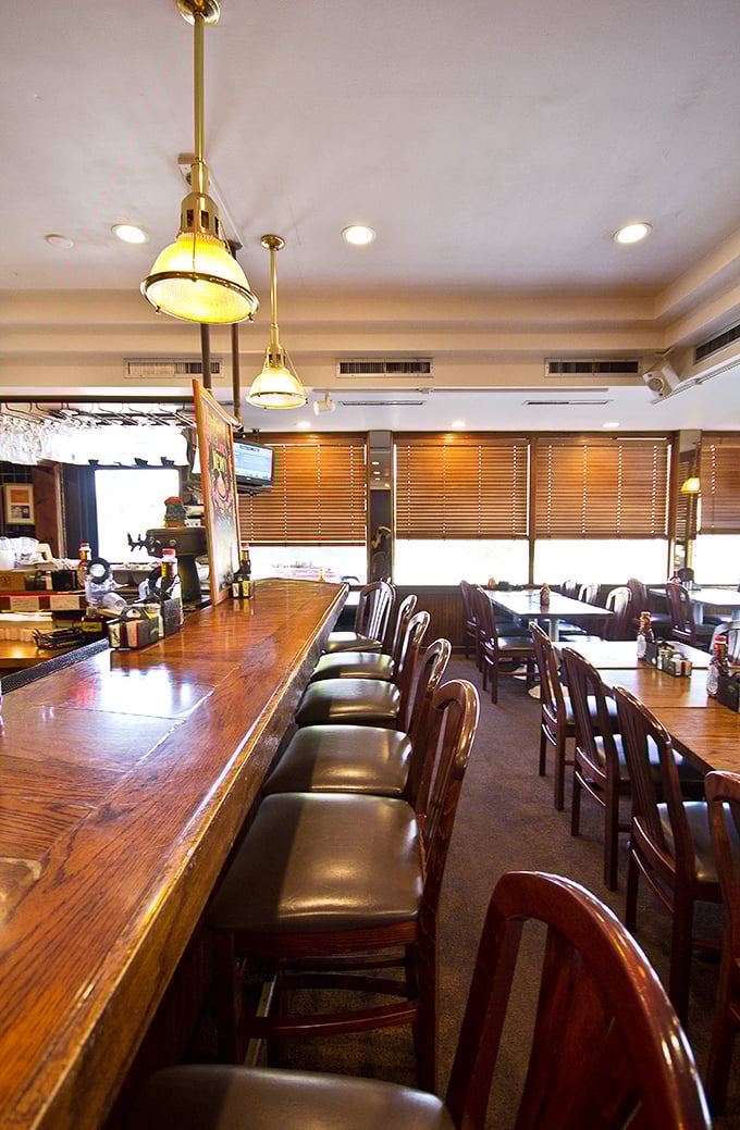 The bar area offers a front-row seat to the breakfast show, where regulars exchange weather reports and vacation plans.