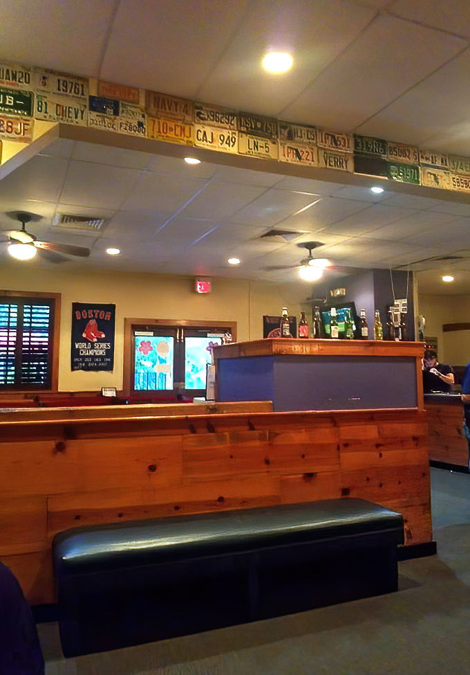 License plates line the ceiling like a road trip through New England states—a subtle reminder of where these recipes began their journey.