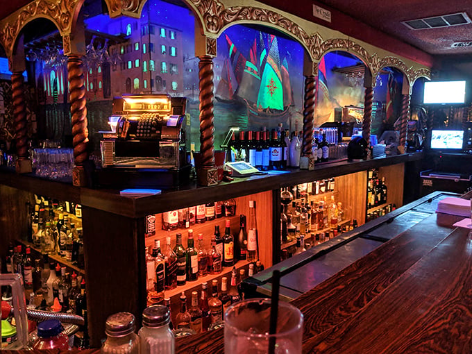 The bar is a masterpiece of old-school craftsmanship – where bottles glow like treasures and the bartenders know the difference between mixing and crafting.
