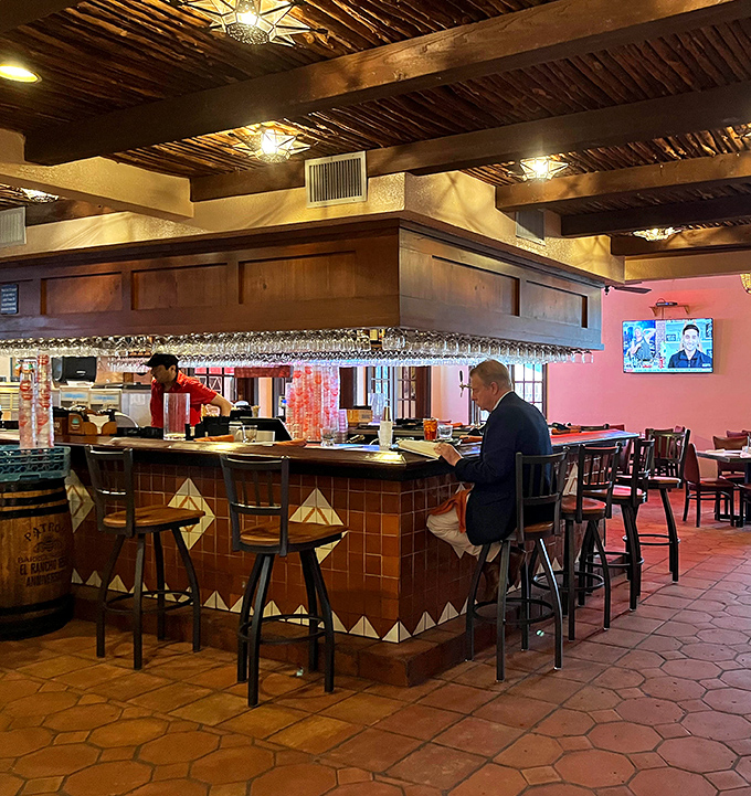The bar where margarita dreams come true. That wooden overhang has witnessed countless toasts, first dates, and "one more round" decisions.