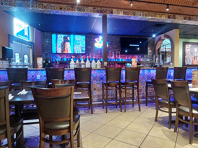 The bar area combines colorful tile work with comfortable seating, creating the perfect backdrop for tequila-fueled conversations.