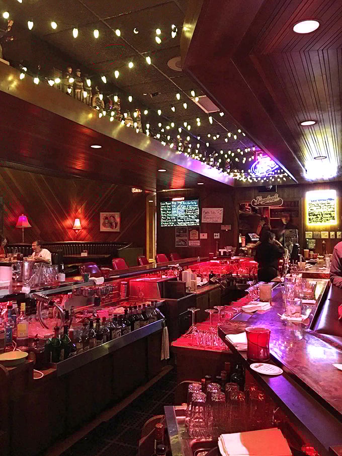 The bar glows with promise under string lights, where Wisconsin's unofficial state cocktail – the brandy old fashioned – reigns supreme.