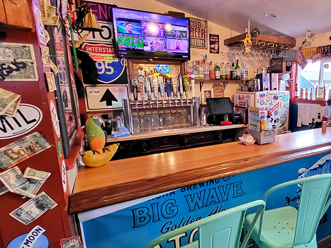 The bar area where cold beer flows and fishing stories grow. Notice how the Big Wave sign promises exactly what the food delivers.