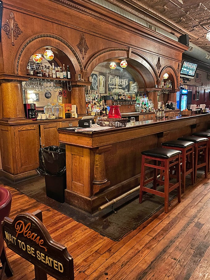 The bar's magnificent wooden arches frame bottles like artwork in a museum dedicated to good times and better stories.