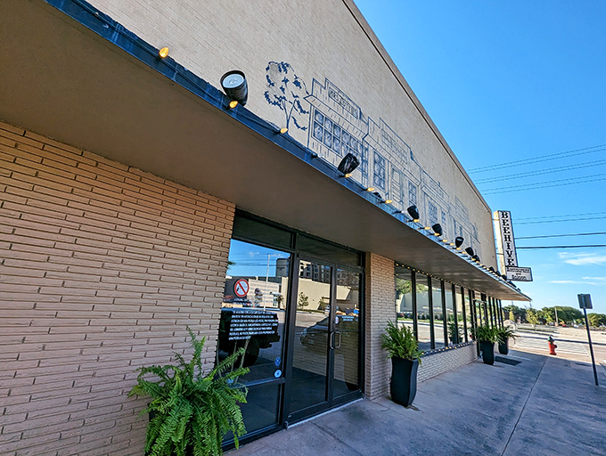 The Beehive Restaurant's mid-century charm and inviting entrance hint at the comfort food and local conversations waiting just beyond those doors.