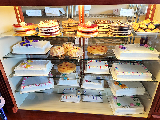 A display case that's hosted more birthday celebrations than a party supply store. Each cake represents someone's special day, made sweeter by Resch's touch.