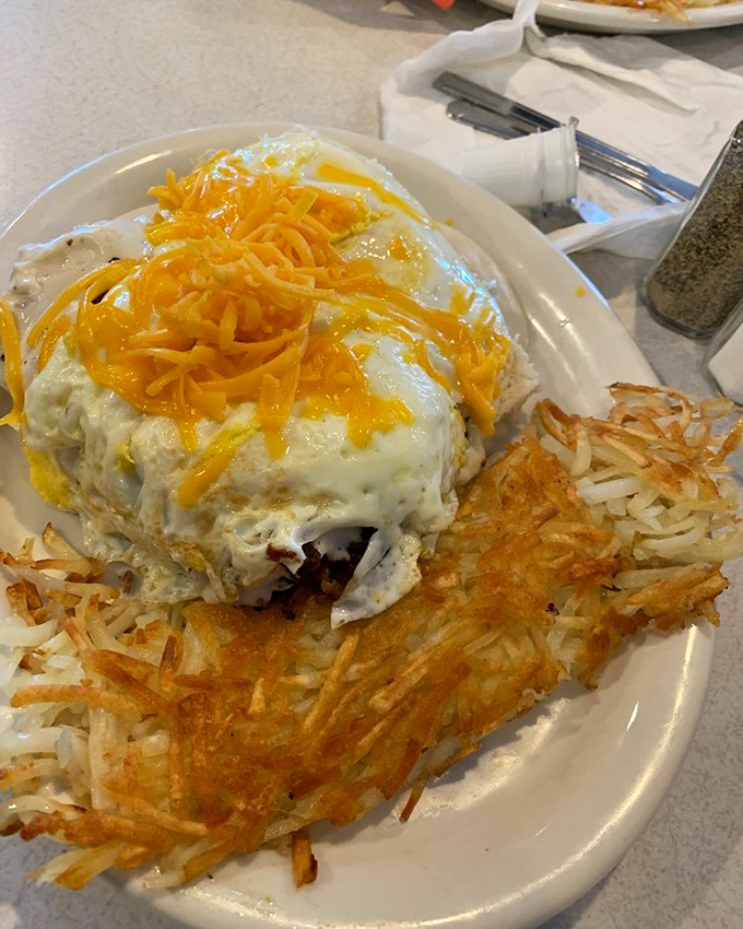 Behold the Biscuit Debris &ndash; where gravy, eggs, and cheese create a beautiful breakfast avalanche that requires both fork and strategy.