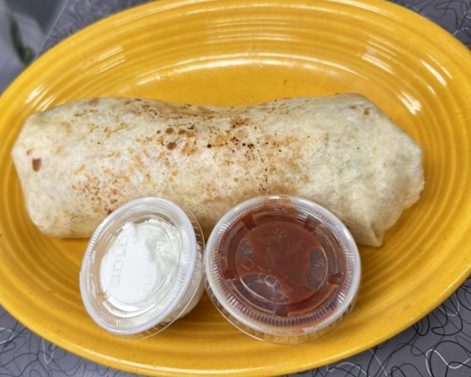 The breakfast burrito&mdash;proof that good things come in cylindrical packages. Those dipping sauces are standing by for flavor enhancement duty.