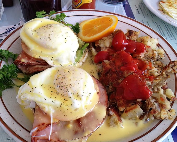 Benedict with a California twist &ndash; poached eggs perched atop Canadian bacon, draped in hollandaise and accessorized with fresh tomatoes.