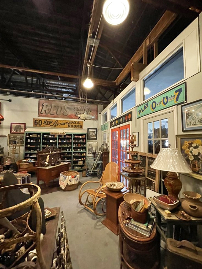 Vintage gas pumps and measuring devices stand sentinel at the entrance, guardians of a bygone era of service and craftsmanship.