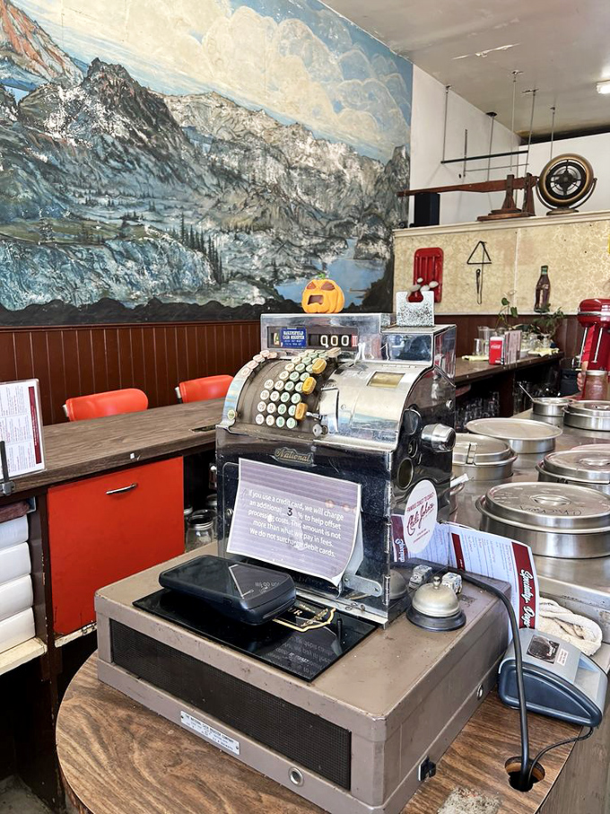 The vintage cash register isn't just for transactions&mdash;it's a museum piece that's witnessed countless "I'll have what they're having" moments.