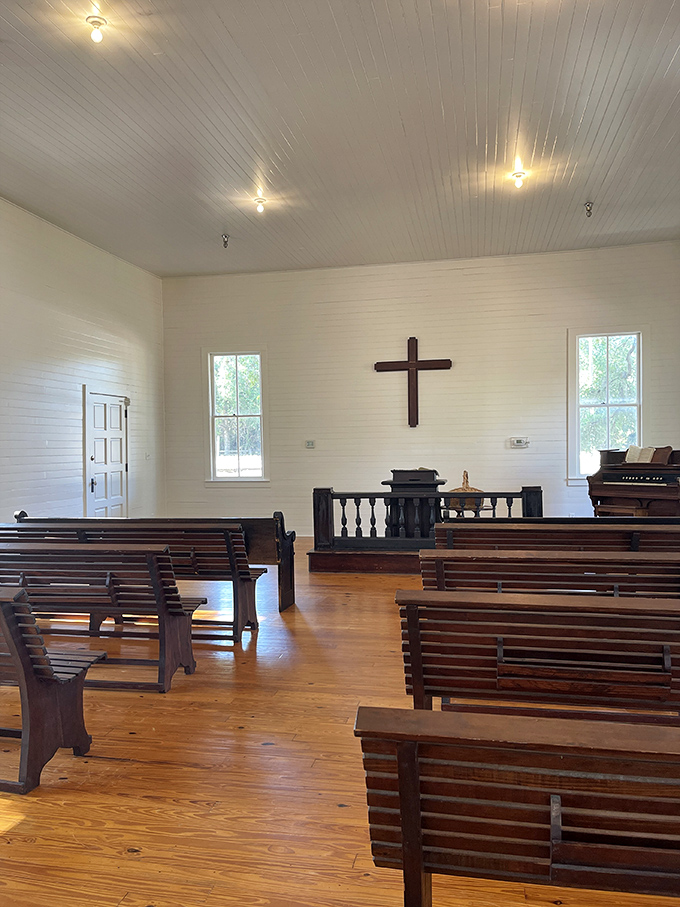 The simple white chapel interior speaks to a time when Sunday best meant your only good outfit and services weren't competing with brunch reservations.