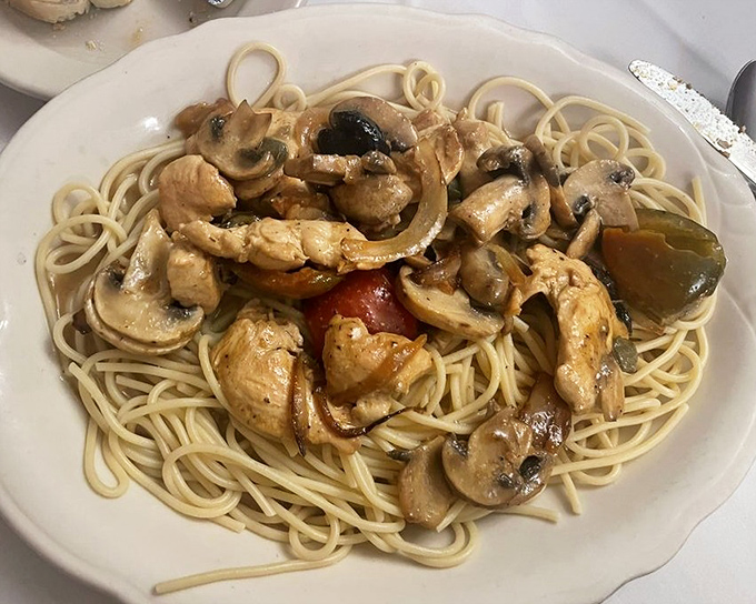 Chicken and mushrooms playing perfectly together on a bed of spaghetti&mdash;like an old married couple who still finish each other's sentences.