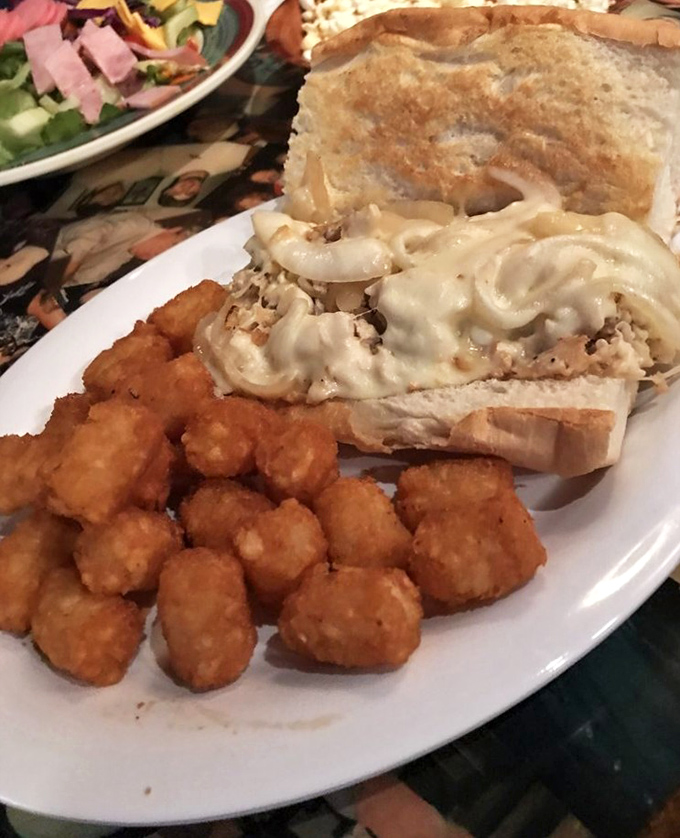 This chicken sandwich with golden tots isn't just lunch &ndash; it's a midday celebration that makes afternoon meetings almost bearable.