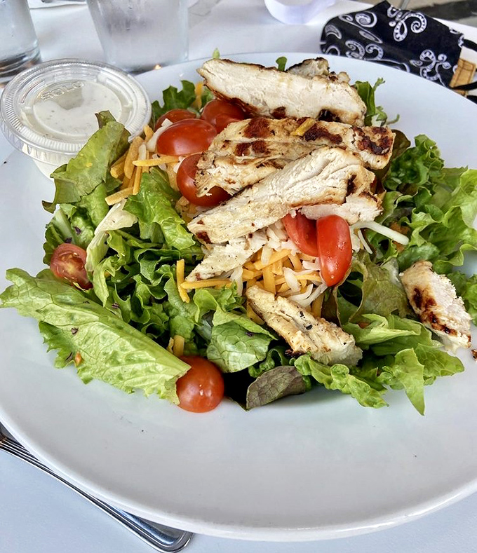 A salad that doesn't feel like punishment&mdash;fresh greens, grilled chicken, and cherry tomatoes that pop with color and flavor.