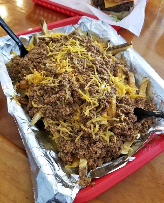 Chili cheese fries that require both a fork and a moment of silent appreciation—the ultimate shareable that nobody actually wants to share.