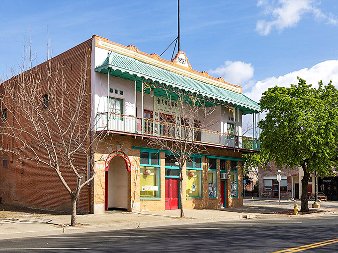 This colorful building with its distinctive green balcony whispers stories of Marysville's once-thriving Chinatown district.