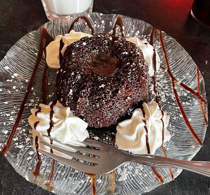 Chocolate lava cake that erupts with warm goodness. Dessert that demands a moment of respectful silence before diving in.
